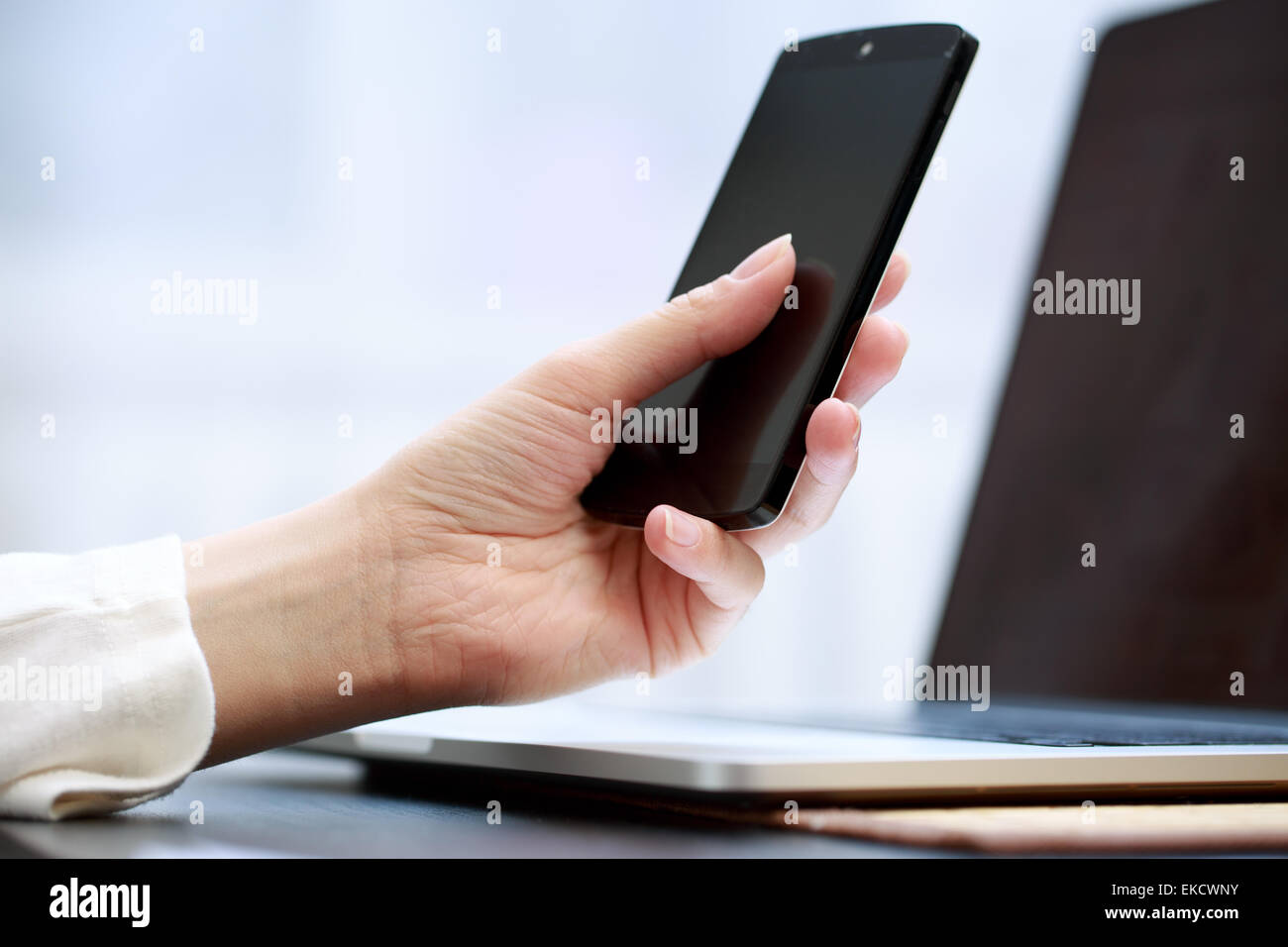 Woman using a mobile phone Stock Photo - Alamy