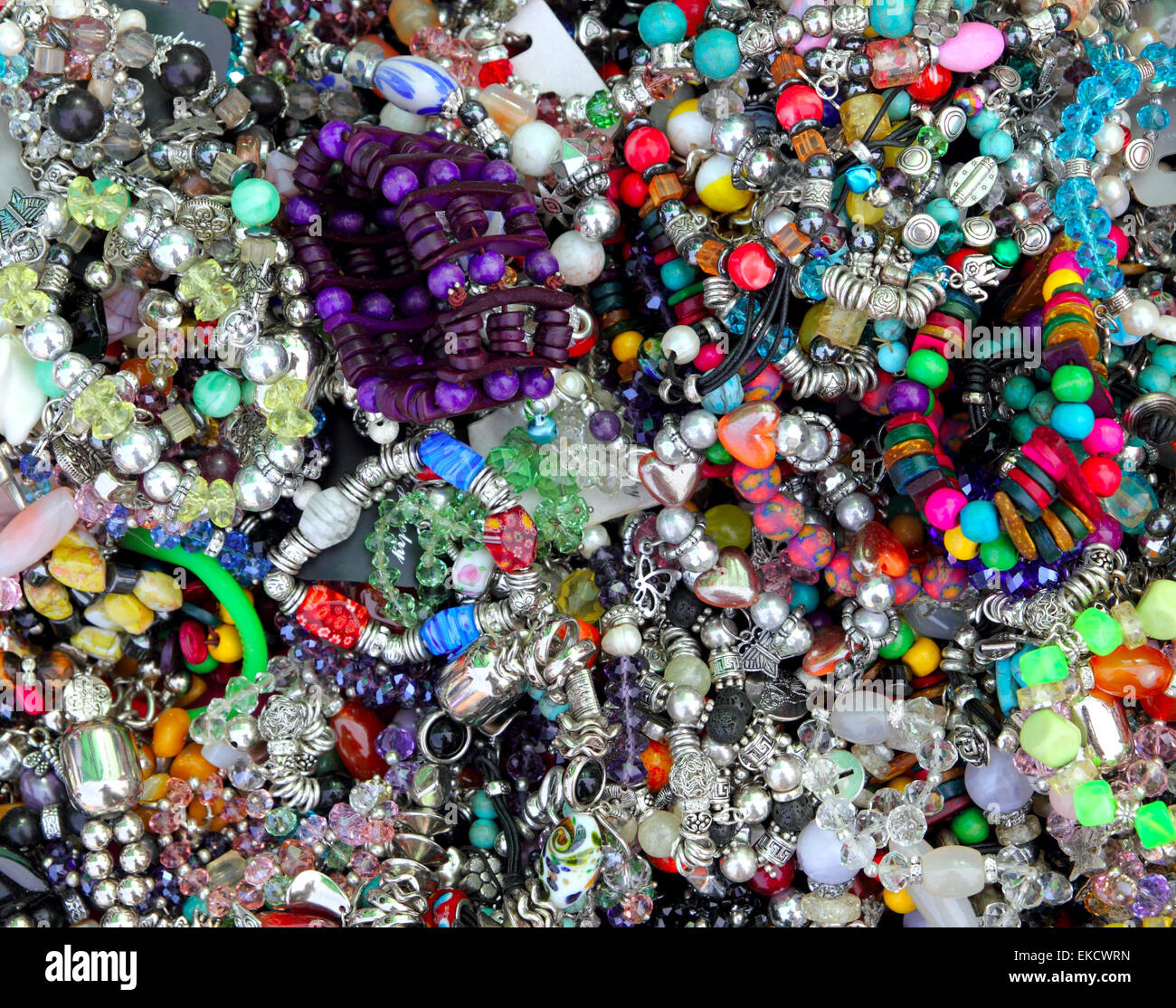 colorful jewellery mixed mess in a retail market Stock Photo - Alamy