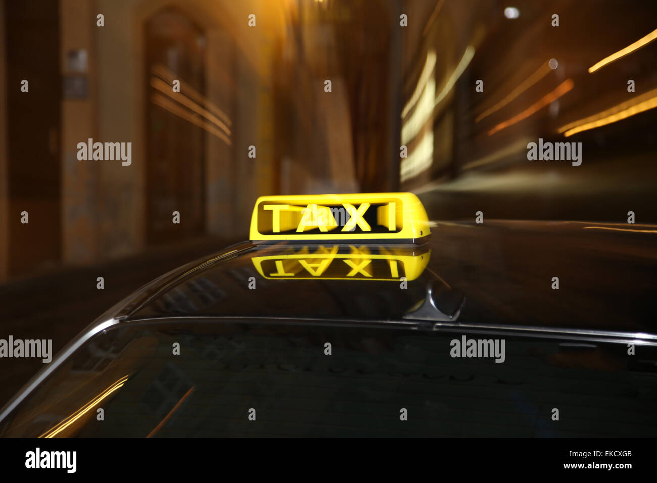 Taxi sign at night, close-up Stock Photo - Alamy