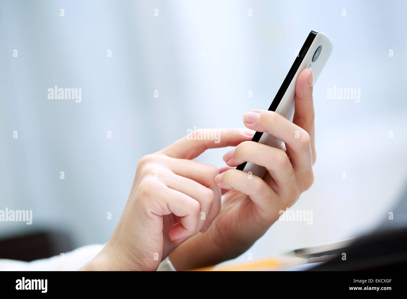 Woman using a mobile phone Stock Photo - Alamy