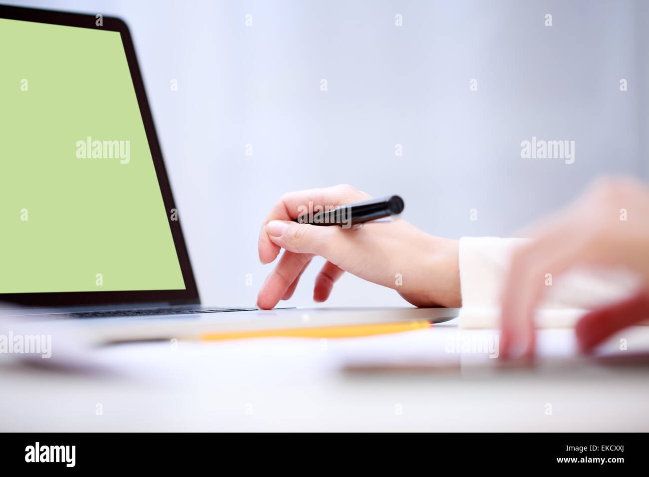 Woman analyzing something at laptop Stock Photo - Alamy