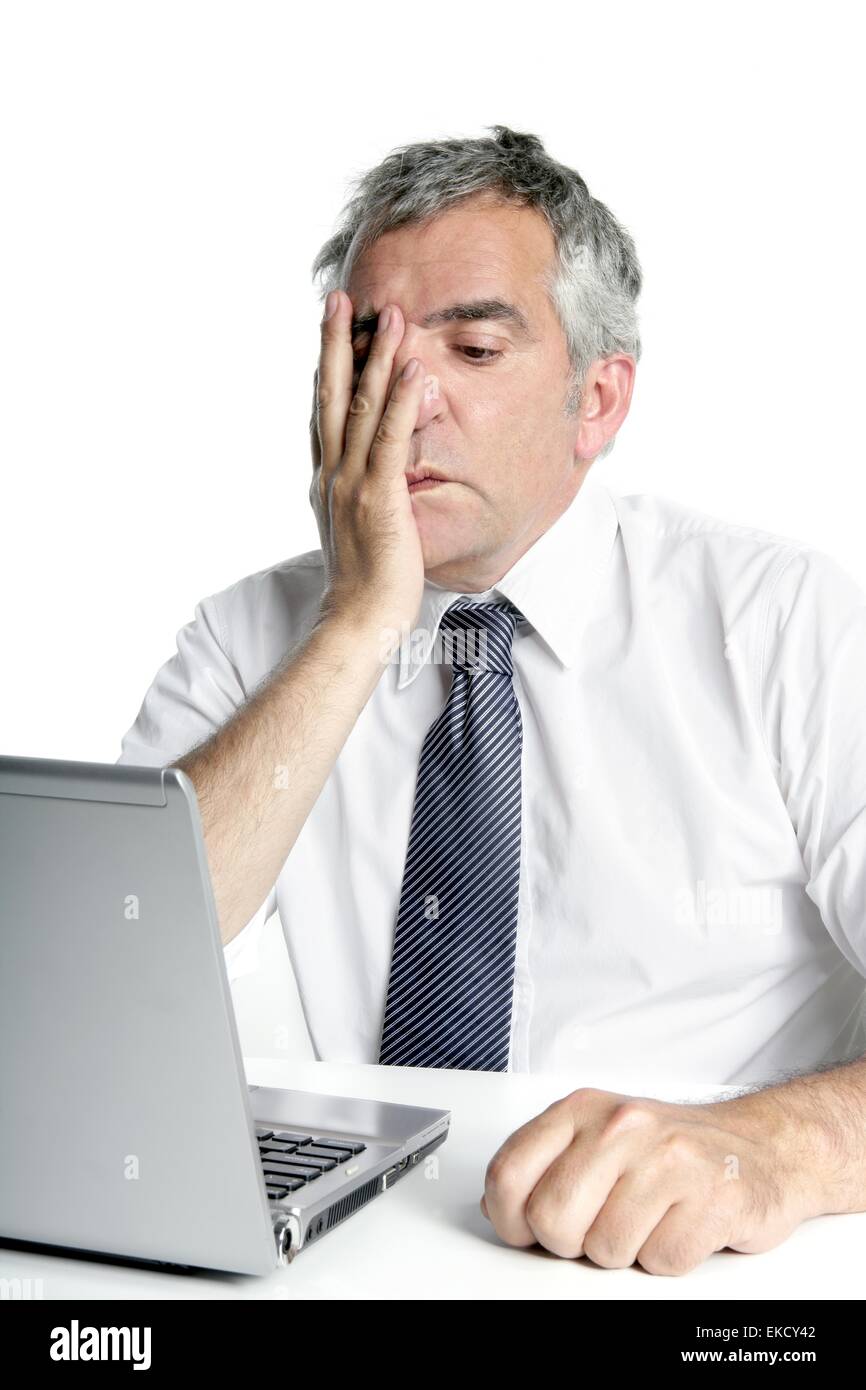 stressed senior businessman gesture work laptop Stock Photo - Alamy