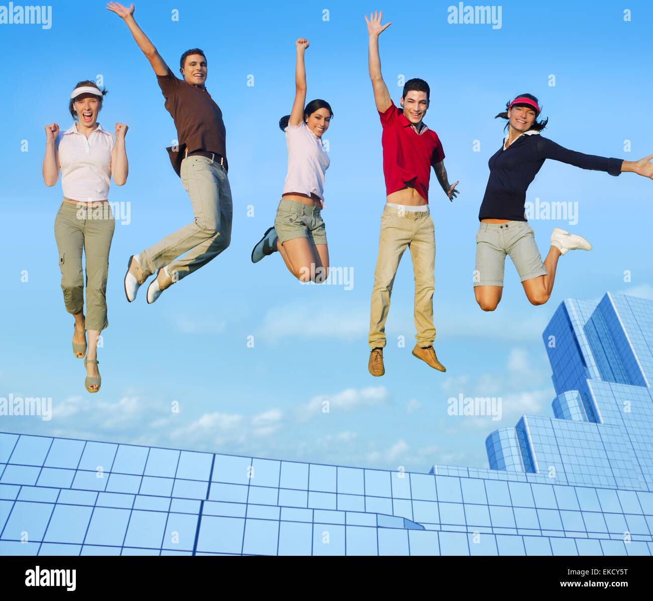 Jumping young people group on city buildings Stock Photo - Alamy
