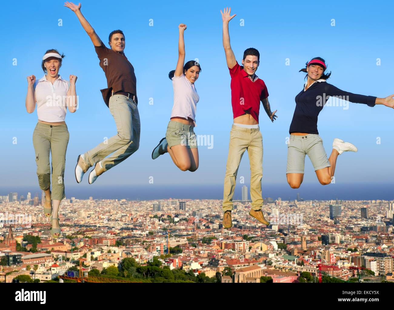 Jumping young people group on city buildings Stock Photo - Alamy