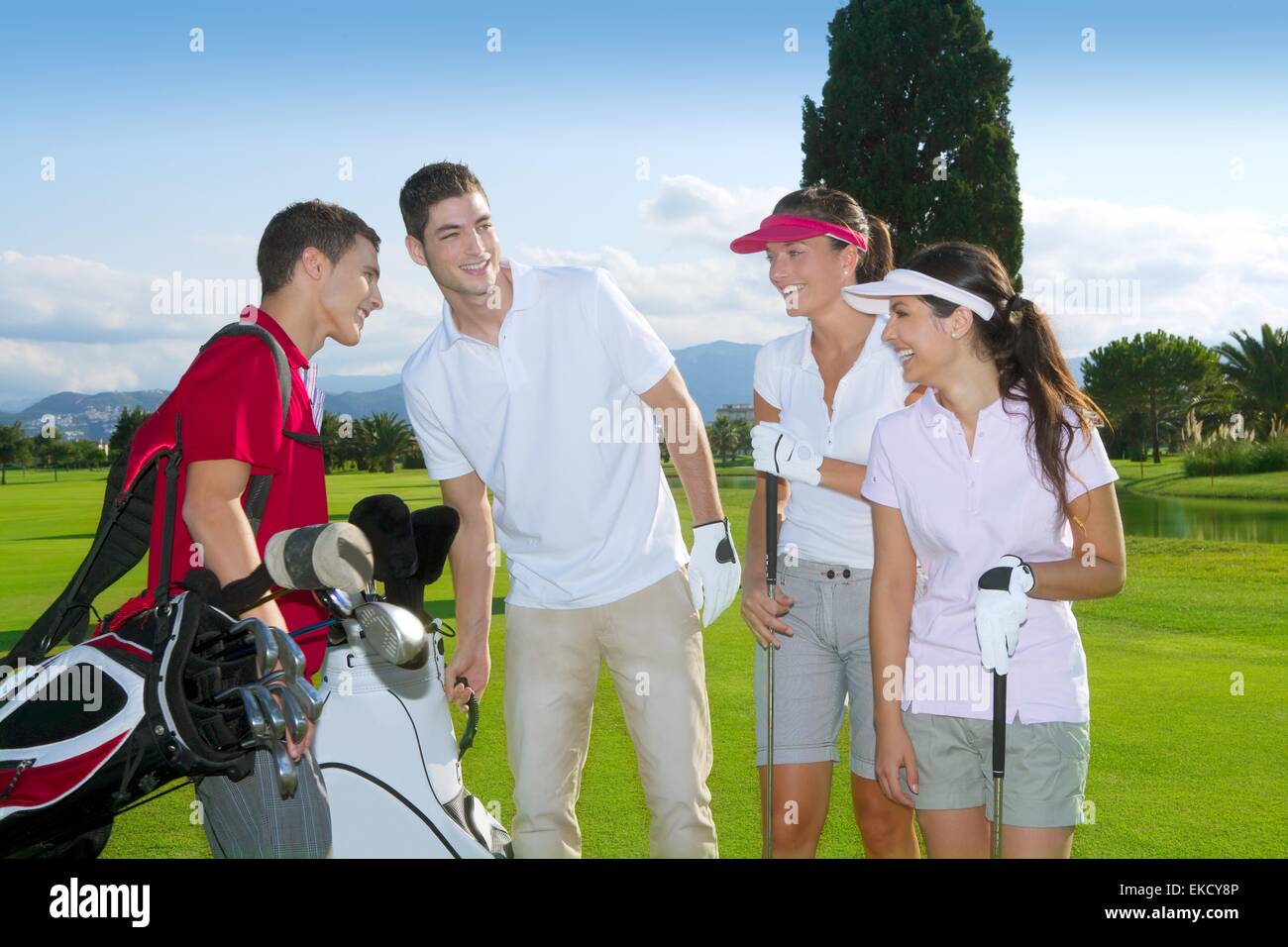 Golf course people group young players team Stock Photo - Alamy