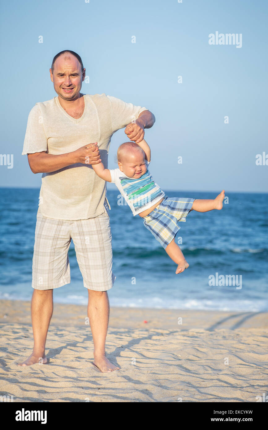 Baby and father having fun time Stock Photo - Alamy