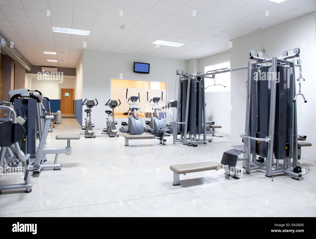 Fitness club gym with sport equipment interior Stock Photo - Alamy