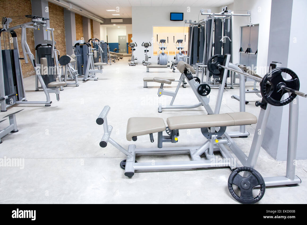 Fitness club gym with sport equipment interior Stock Photo - Alamy