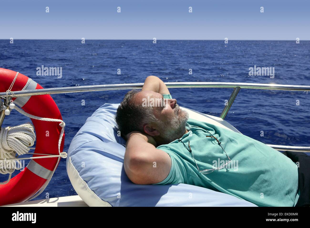 Sailor senior man having a rest on summer boat Stock Photo - Alamy