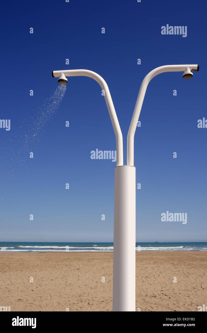 Beach shower over blue sky sand sea Stock Photo - Alamy