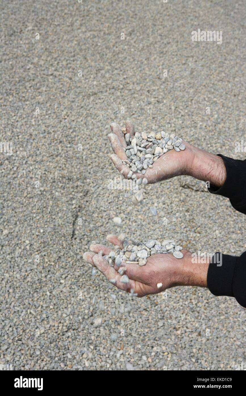 Gravel sand in man hands hi-res stock photography and images - Alamy