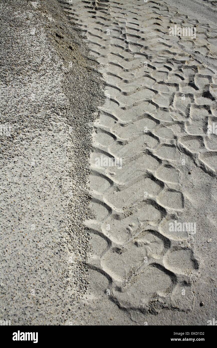 excavator tyres footprint on quarry white sand Stock Photo - Alamy