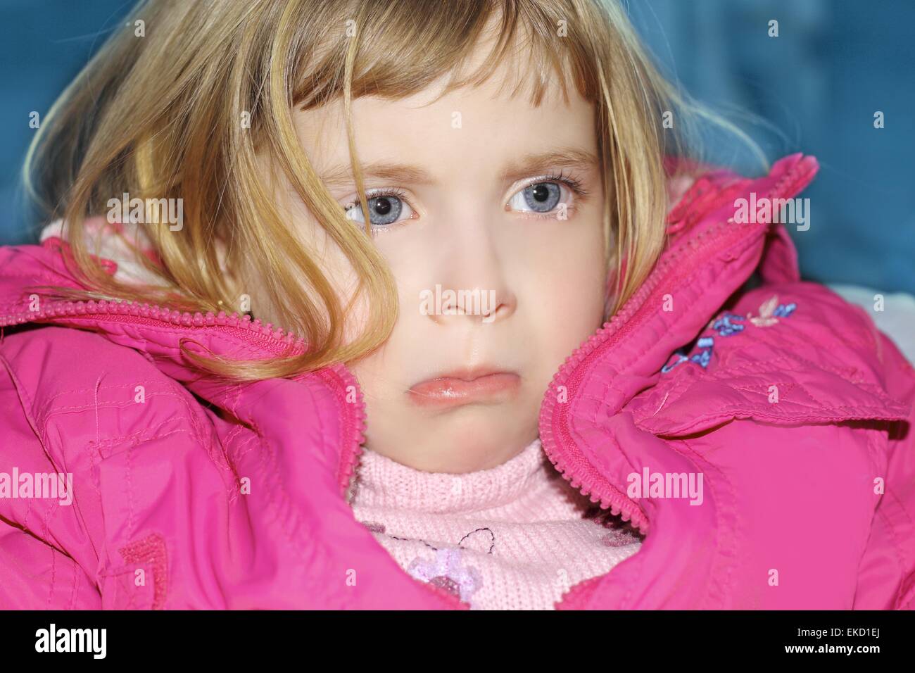 sad gesture in blond little girl portrait Stock Photo - Alamy