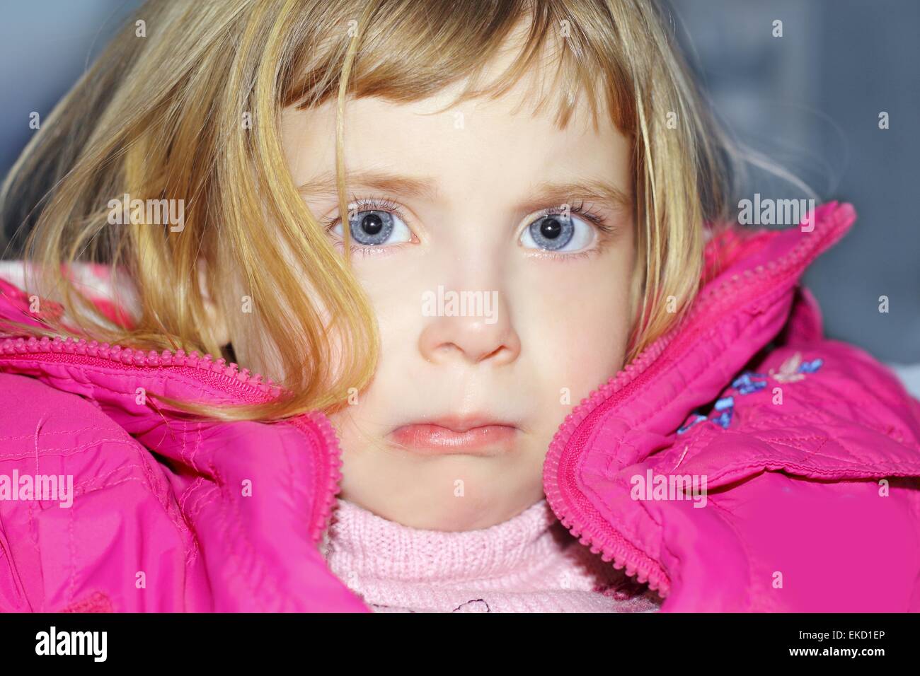 sad gesture in blond little girl portrait Stock Photo - Alamy