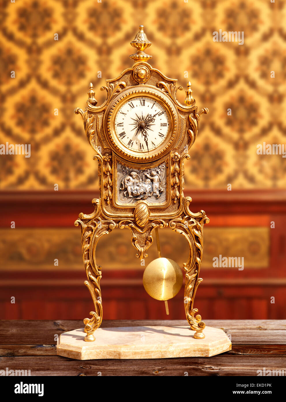ancient vintage brass pendulum clock in classic Stock Photo - Alamy