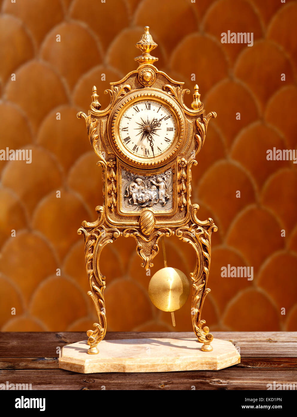 ancient vintage golden brass pendulum clock Stock Photo - Alamy
