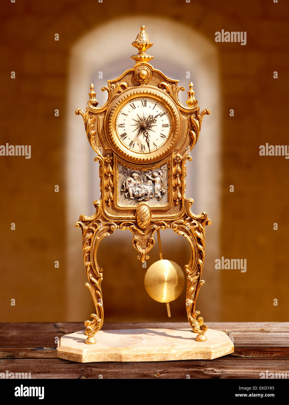 ancient vintage golden brass pendulum clock Stock Photo - Alamy