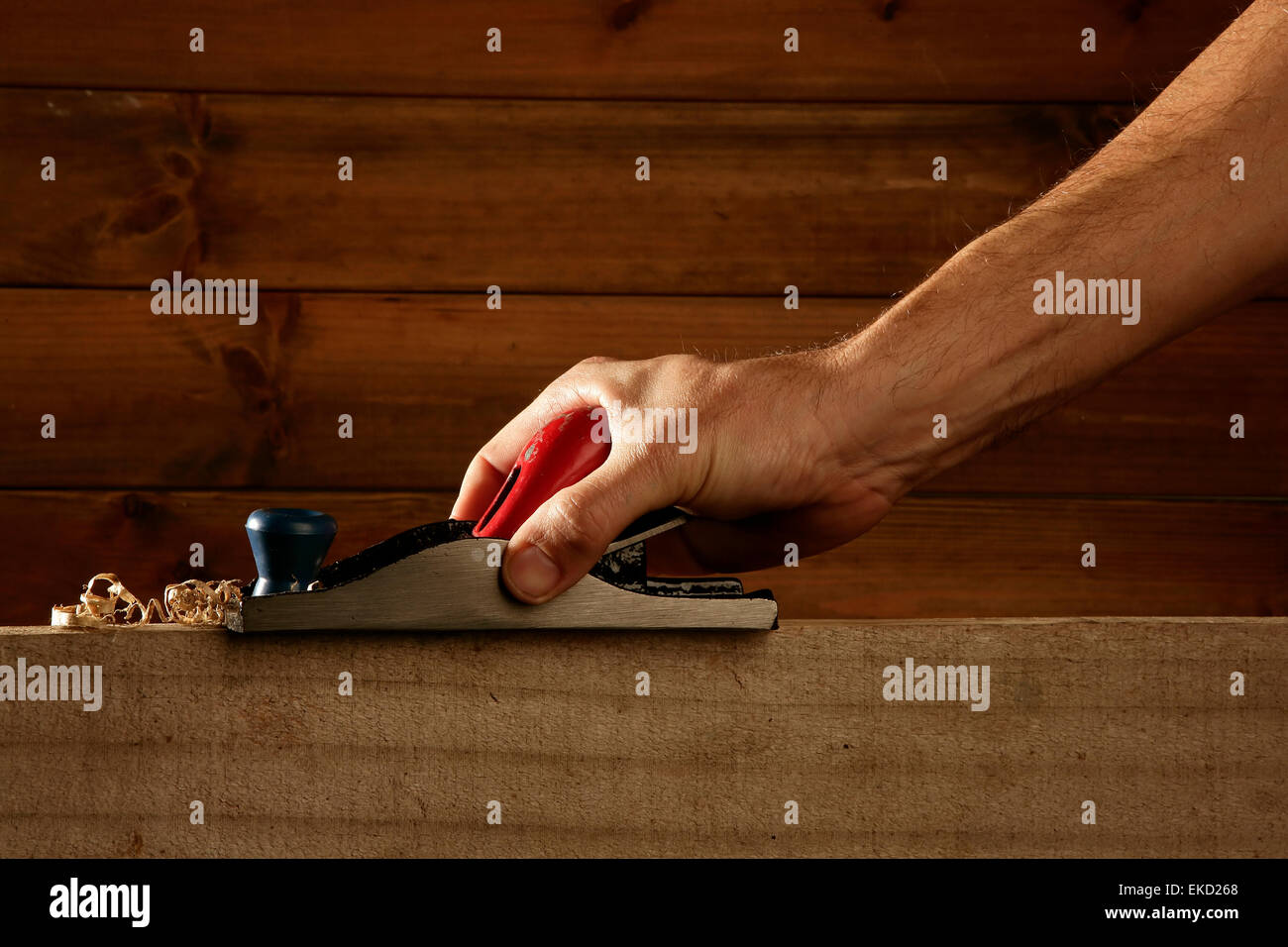 carpenter planning wood planer tool man hand Stock Photo - Alamy