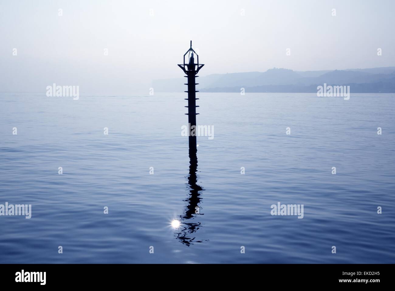 backlight beacon in Mediterranean blue sea reflection Stock Photo - Alamy
