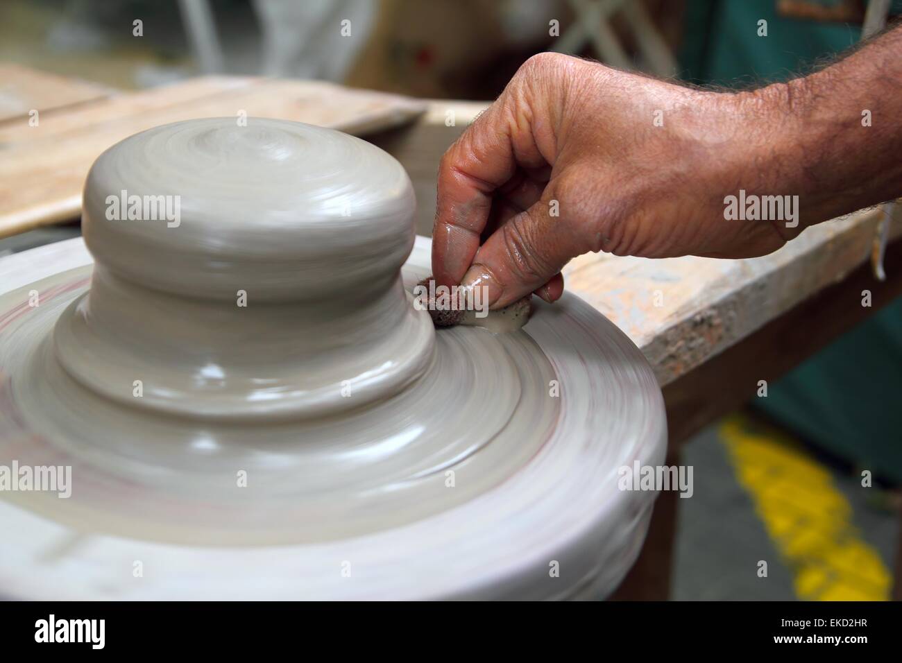 man potter hands working on pottery clay wheel Stock Photo - Alamy
