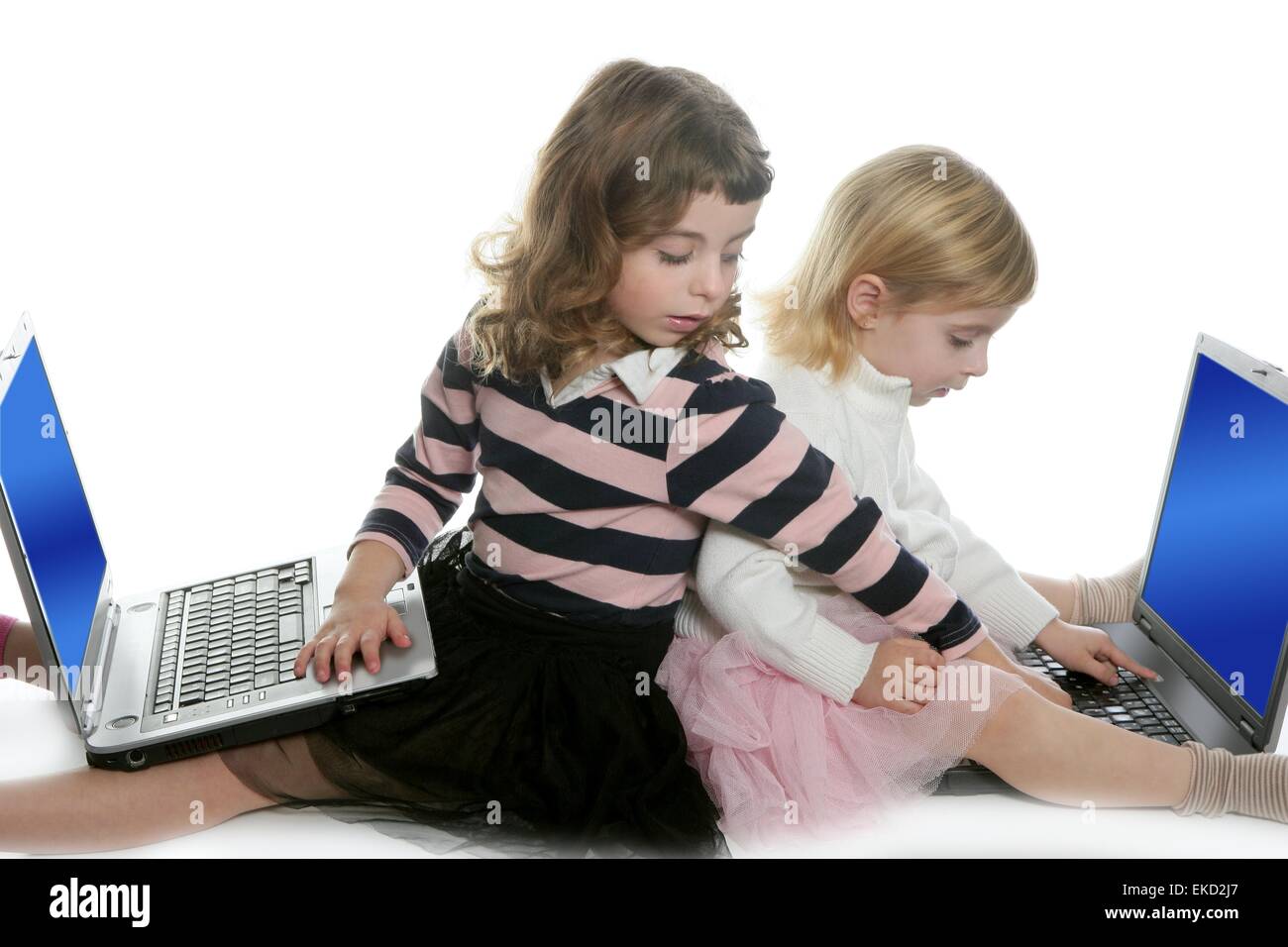 two little girls sister with computer laptops Stock Photo - Alamy