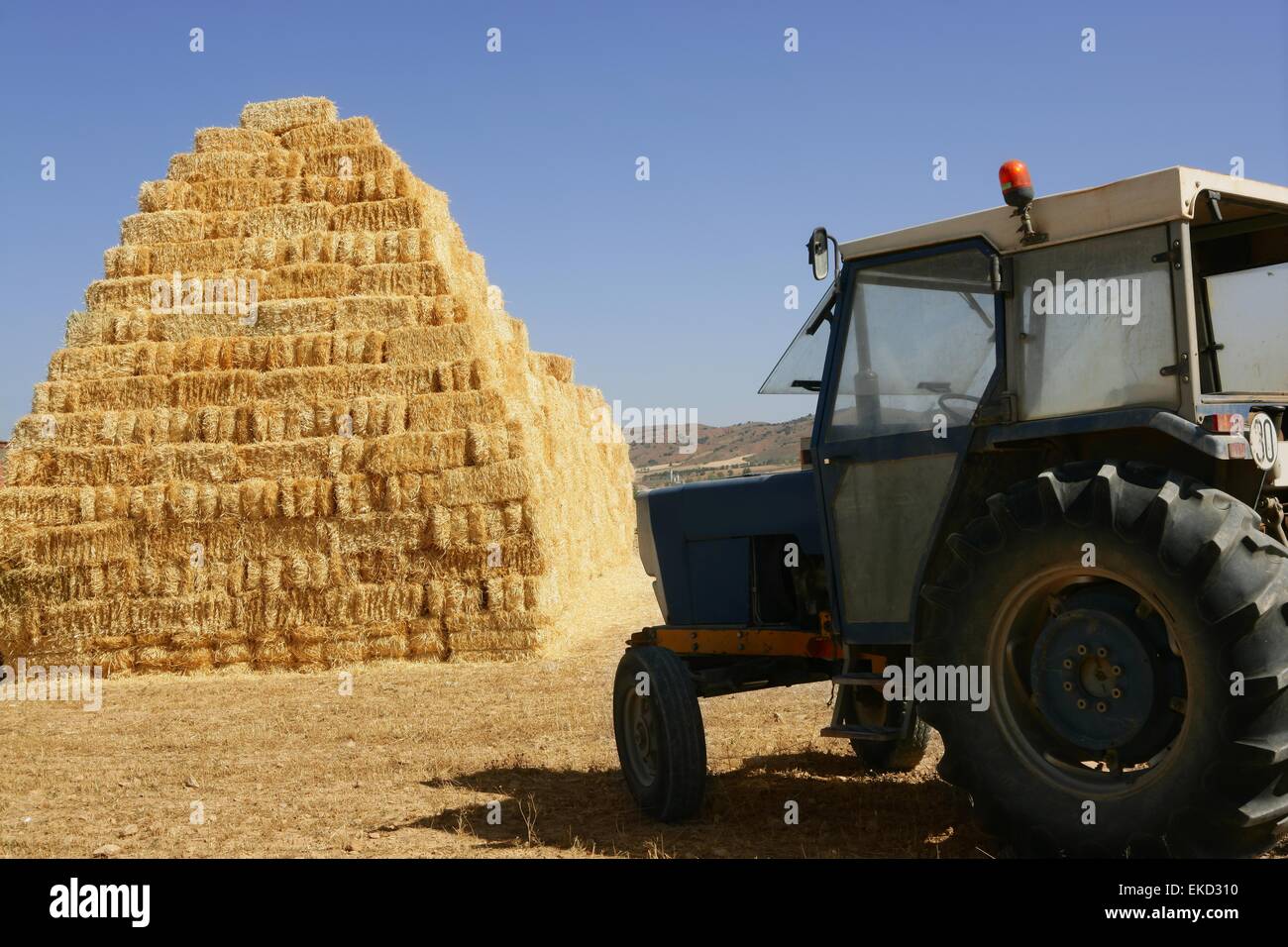 Barn stacked and agriculture tractor Stock Photo - Alamy
