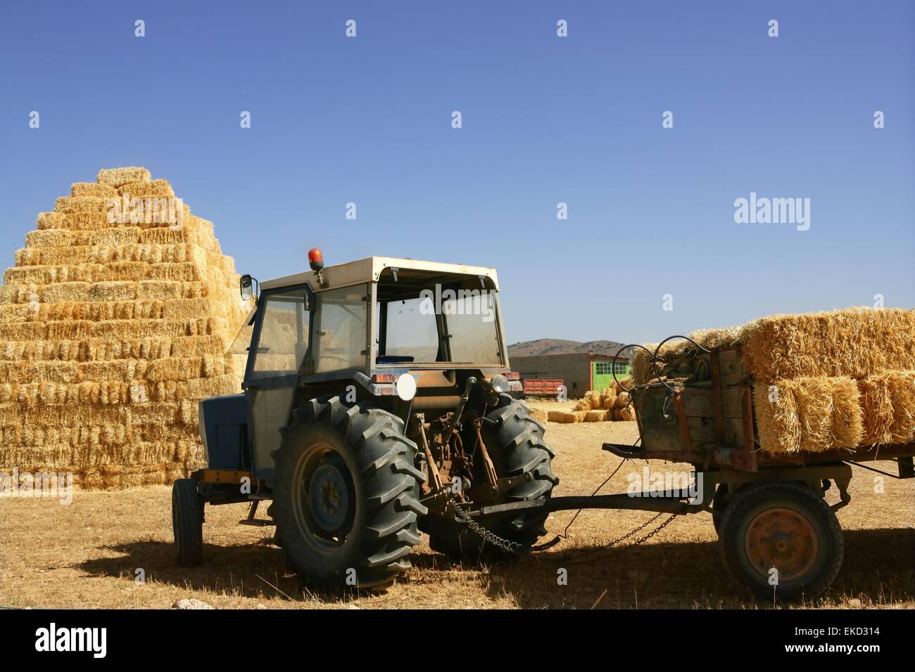 Barn stacked and agriculture tractor Stock Photo - Alamy