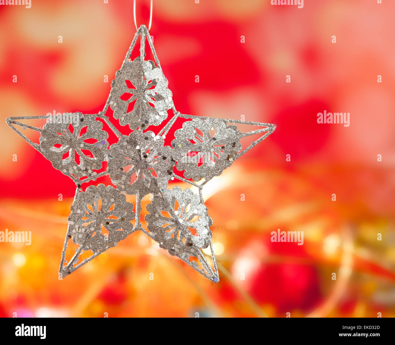 Christmas card of silver star and red blur Stock Photo - Alamy