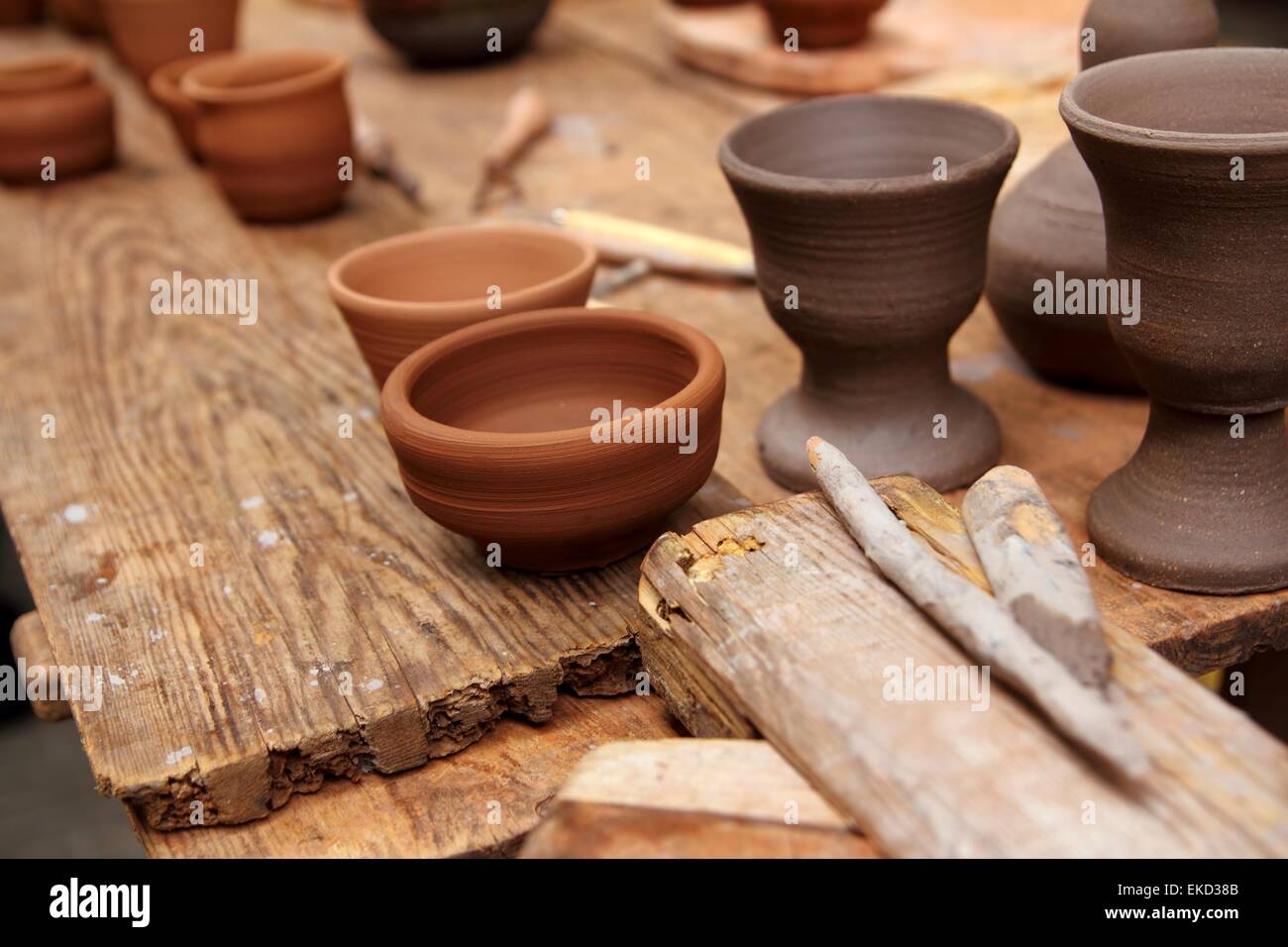 clay pottery potter handcrafts on vintage table Stock Photo - Alamy