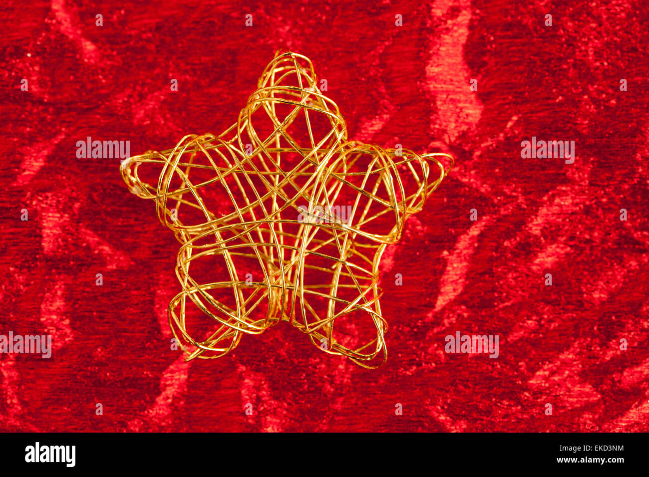 christmas golden star of wire over red Stock Photo - Alamy