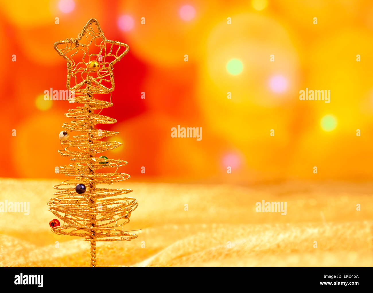 Christmas golden wire tree in blurred lights Stock Photo - Alamy