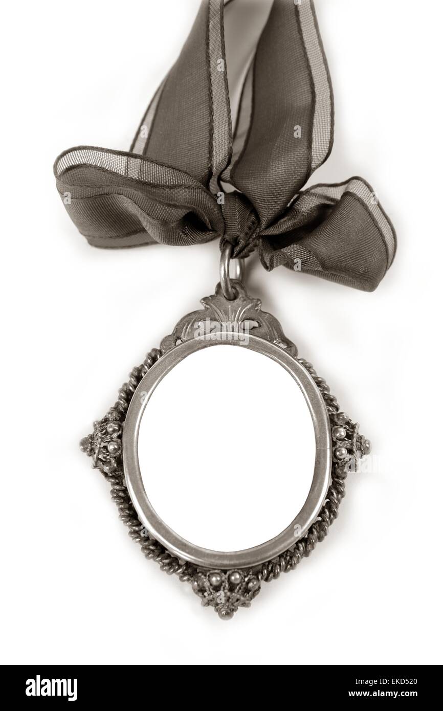 Cameo silver locket with tape loop copyspace Stock Photo - Alamy