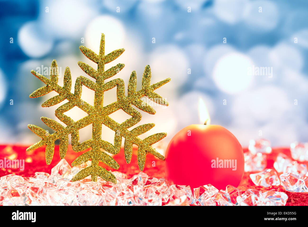 Christmas golden snowflake on ice cubes Stock Photo - Alamy