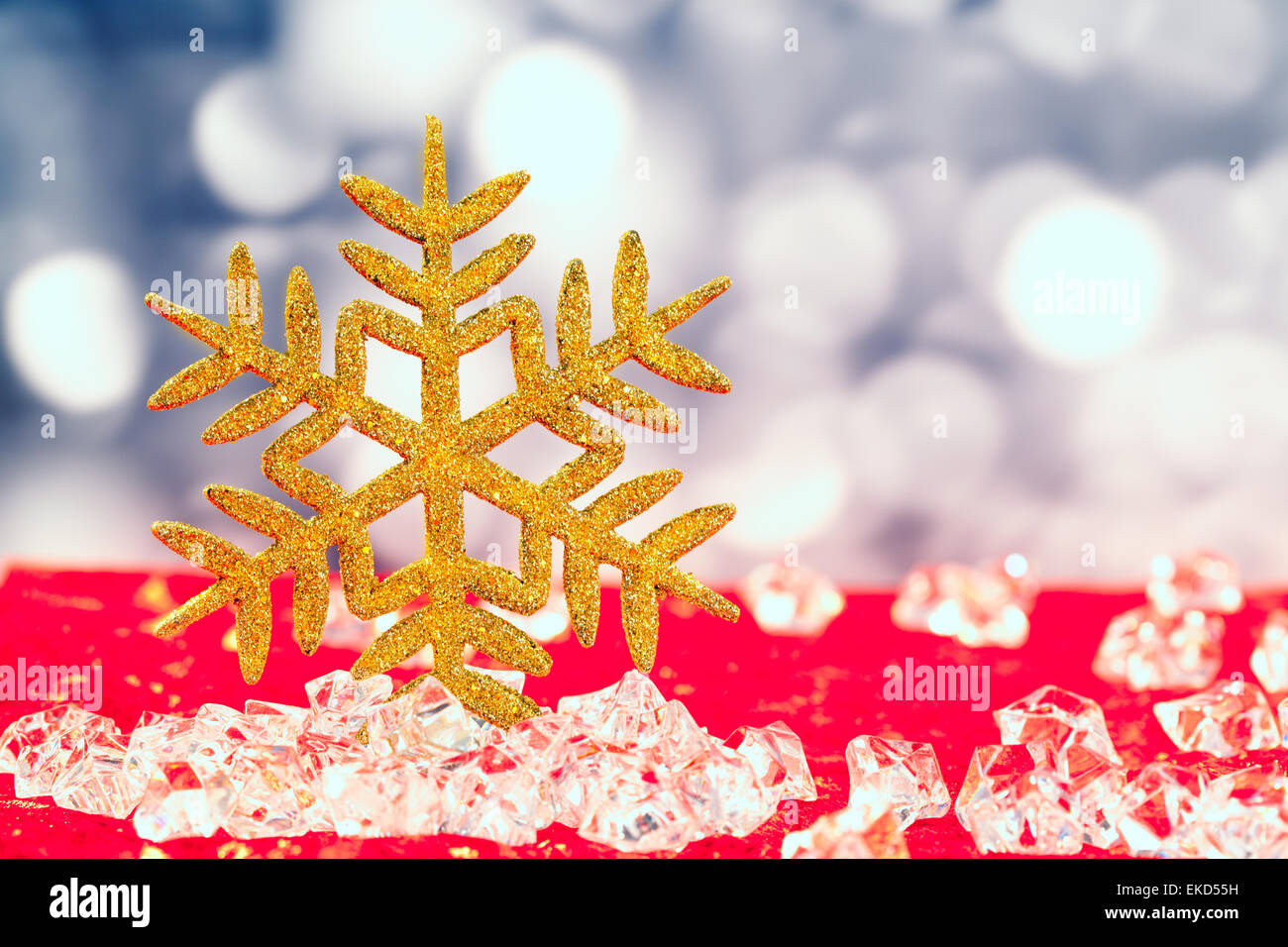 Christmas golden snowflake on ice cubes Stock Photo - Alamy