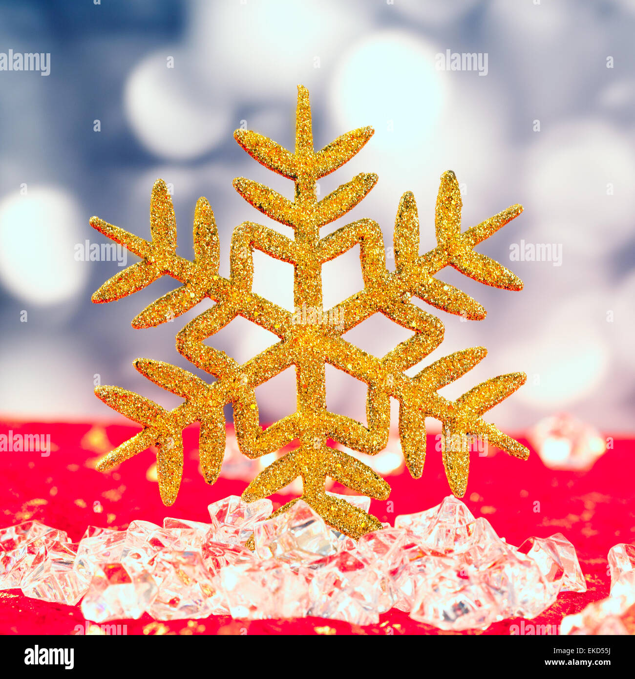 Christmas golden snowflake on ice cubes Stock Photo - Alamy