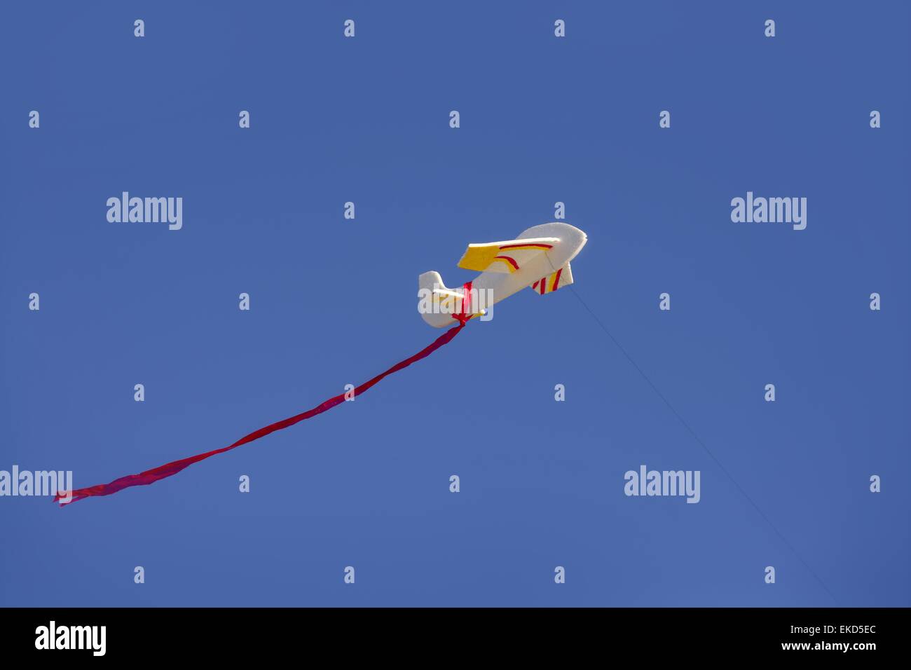 Airplane kite flying on blue sunny sky Stock Photo - Alamy