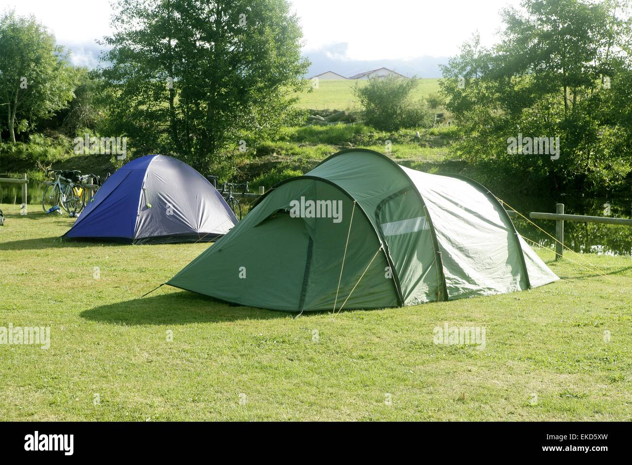 Camping tent field over green grass Stock Photo - Alamy