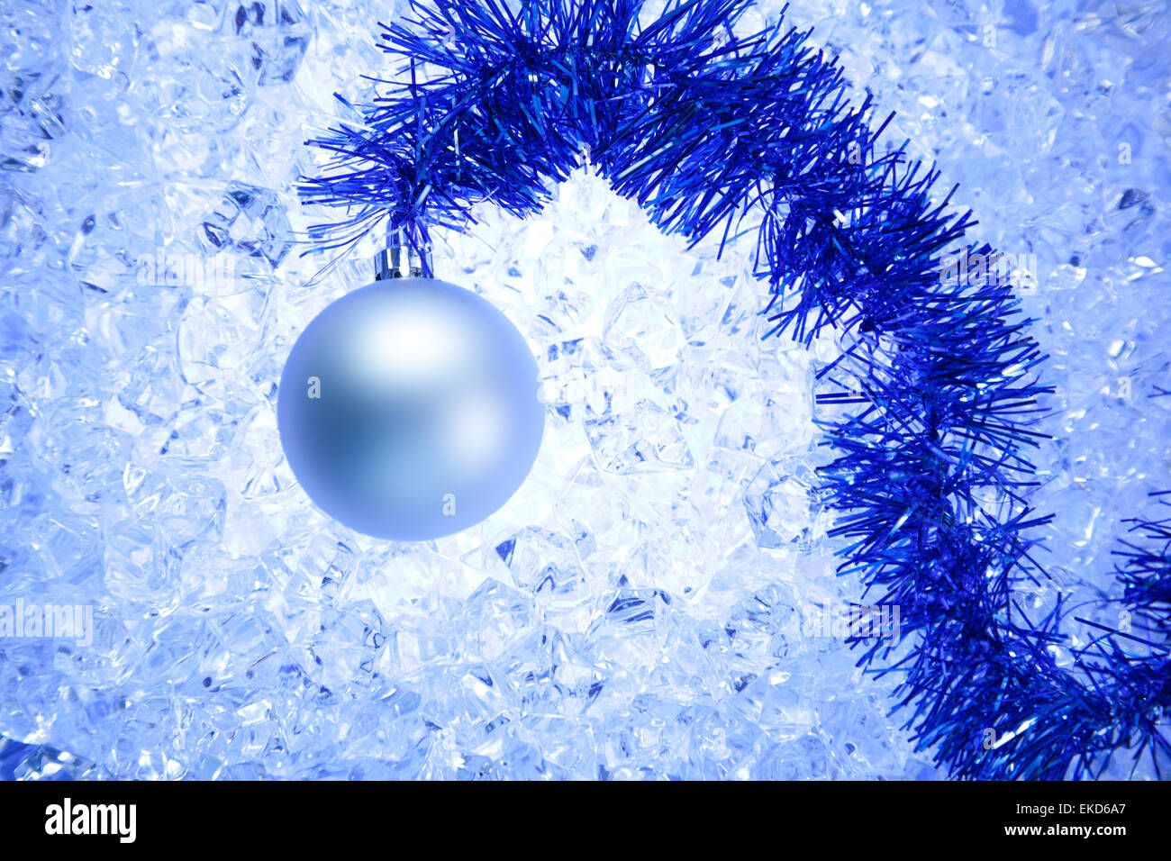 christmas silver bauble on blue winter ice Stock Photo - Alamy