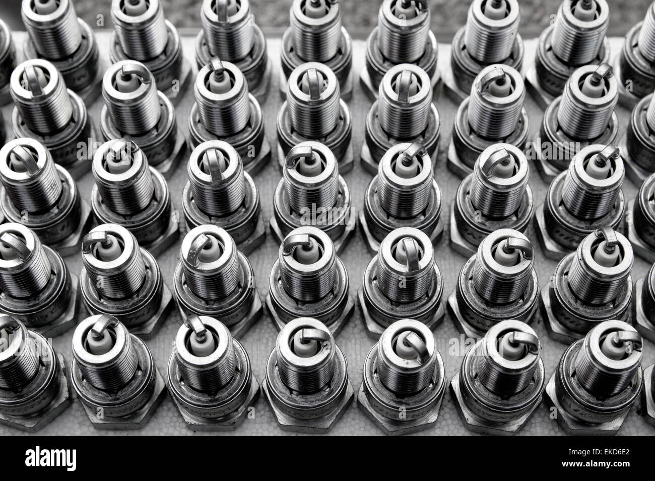 car spark plugs rows pattern mechanical engine pieces Stock Photo - Alamy