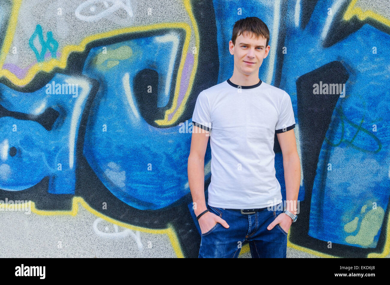 Boy in front of graffiti Stock Photo - Alamy