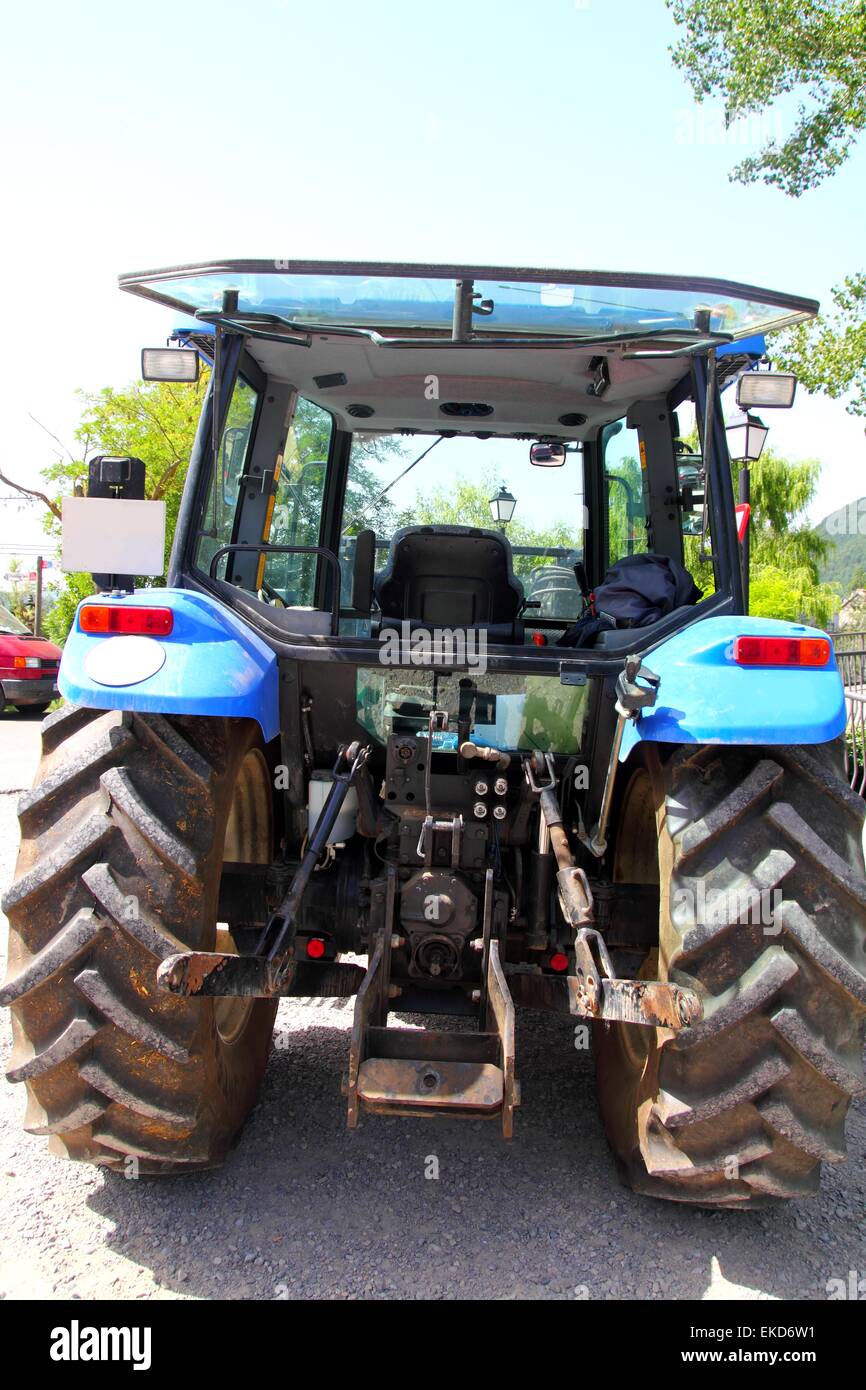 Tractor back end view big wheels blue color Stock Photo - Alamy