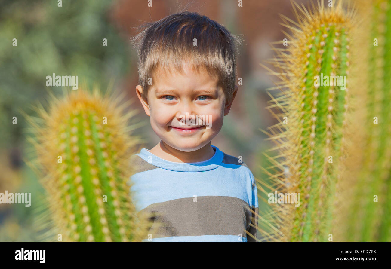Boy with cactus Stock Photo - Alamy