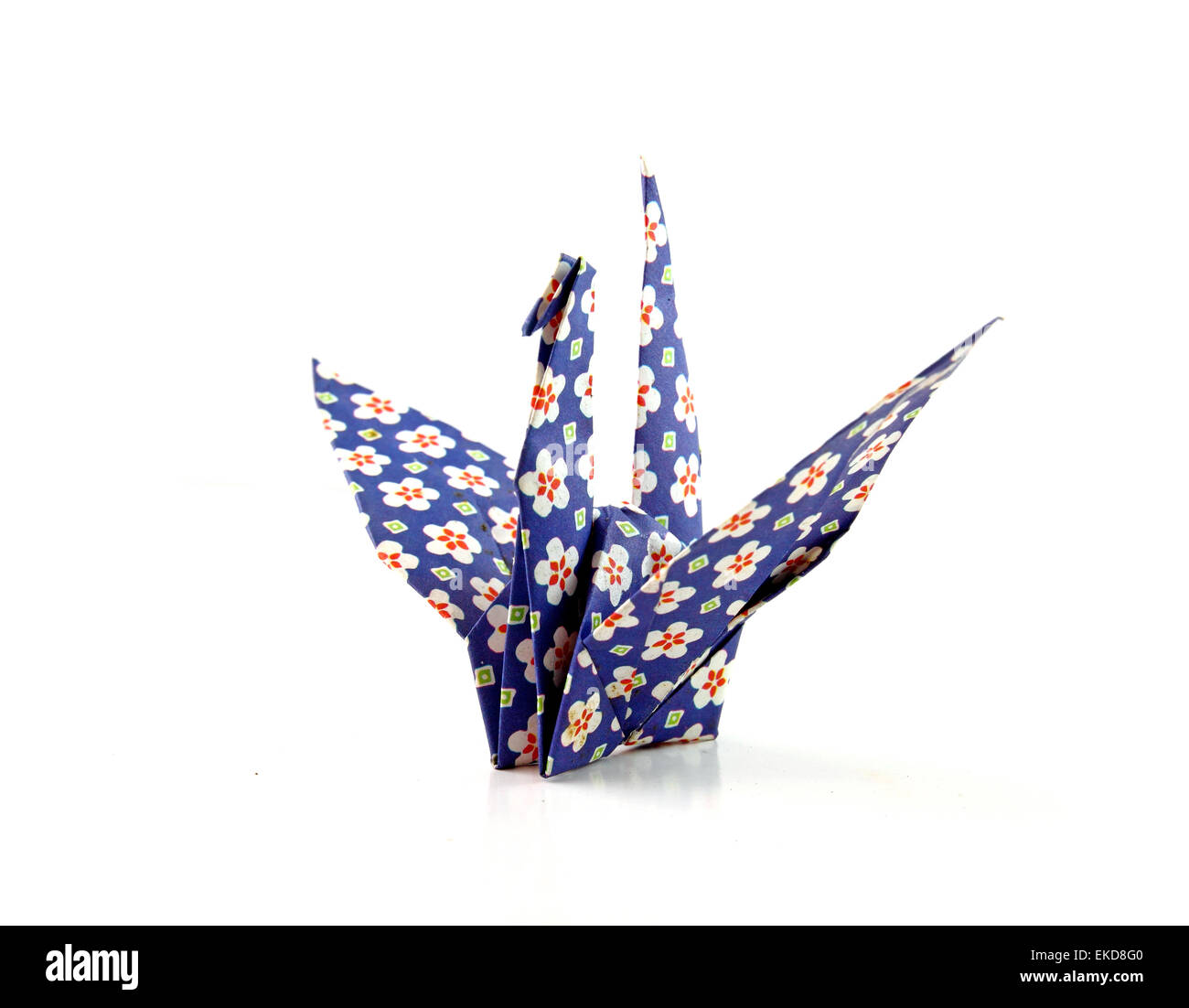 Crane origami bird folded with a floral pattern paper Stock Photo - Alamy