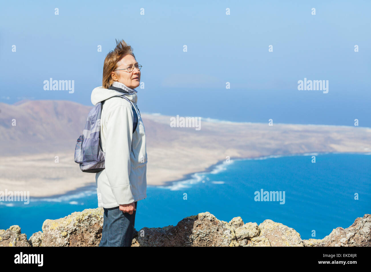 Portrait senior woman with backpack Stock Photo - Alamy