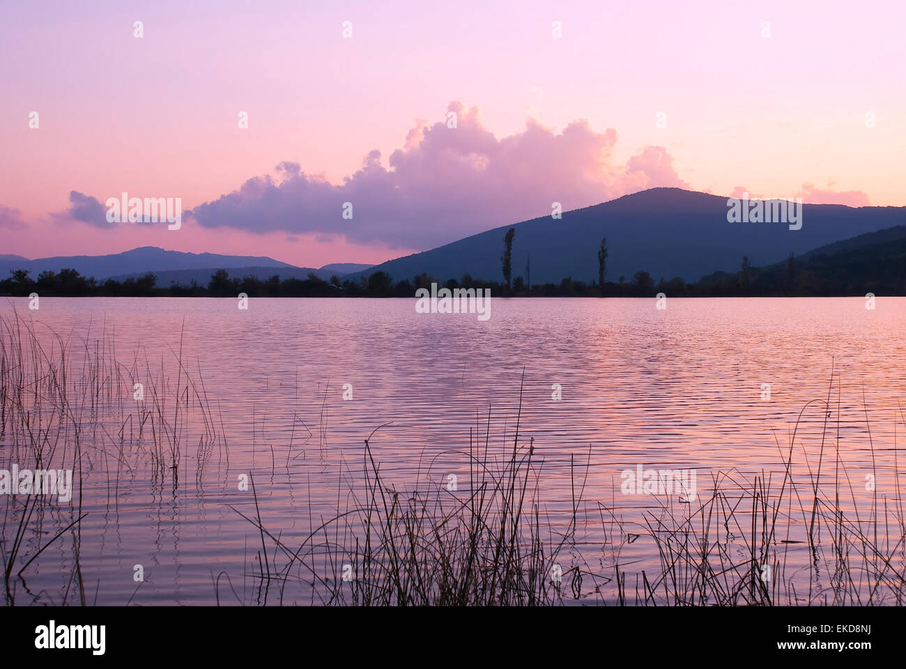A calm evening landscape with lake and mountains Stock Photo - Alamy