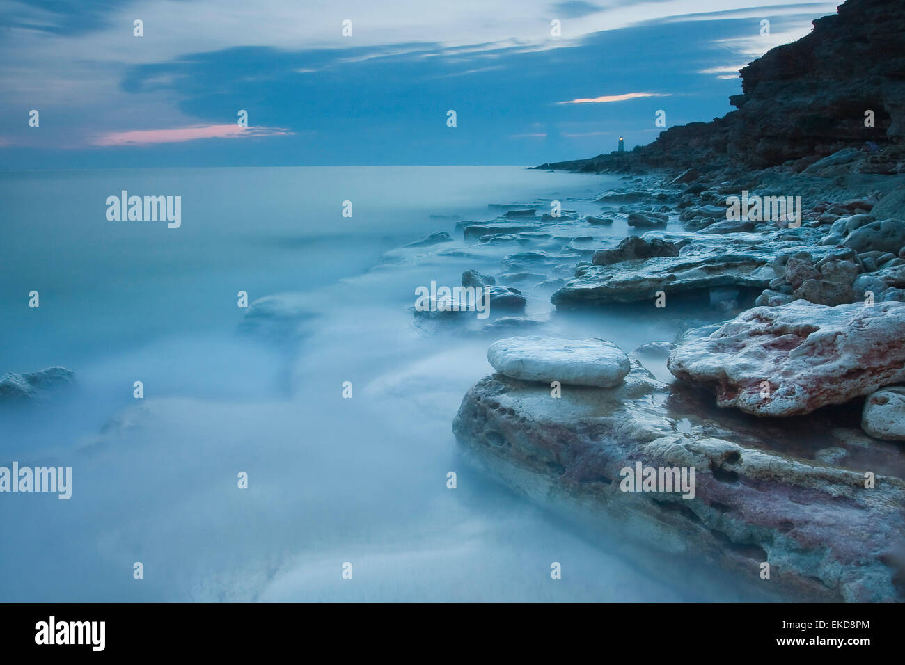 Beautiful rocky sea beach at the sunset Stock Photo - Alamy
