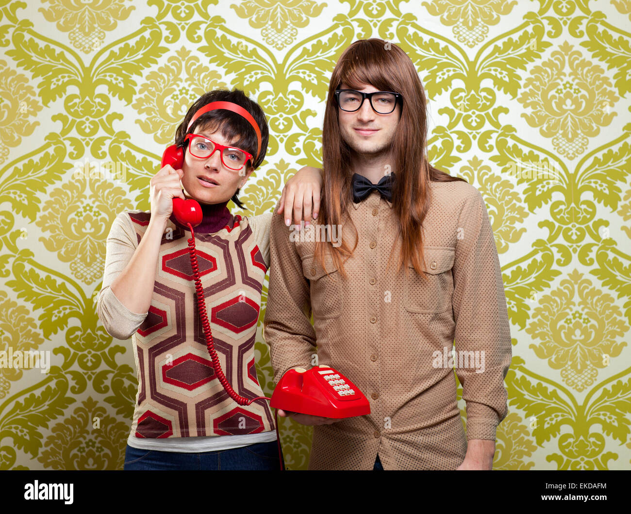 nerd humor couple talking vintage red phone Stock Photo - Alamy