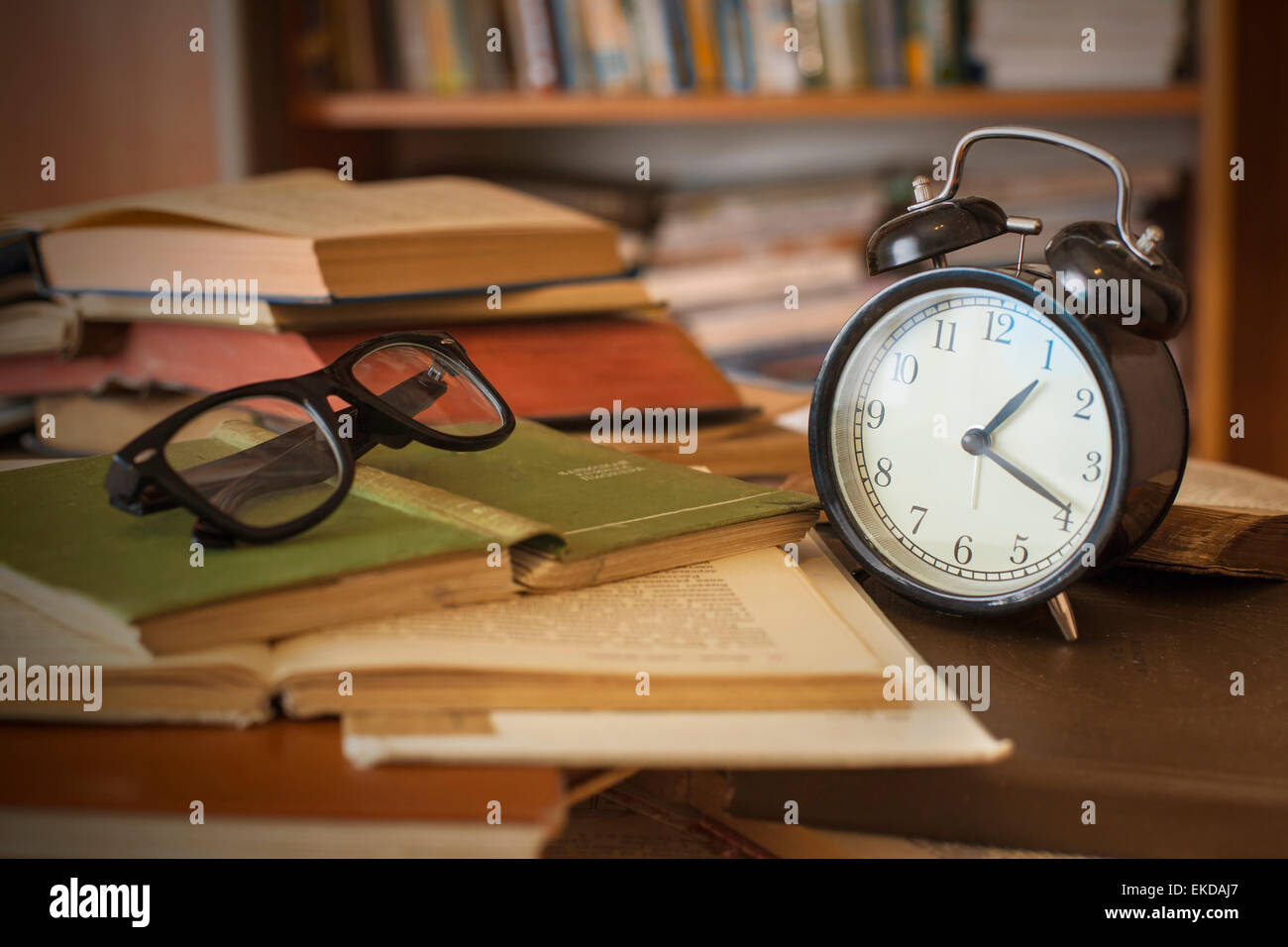 books with clock Stock Photo - Alamy