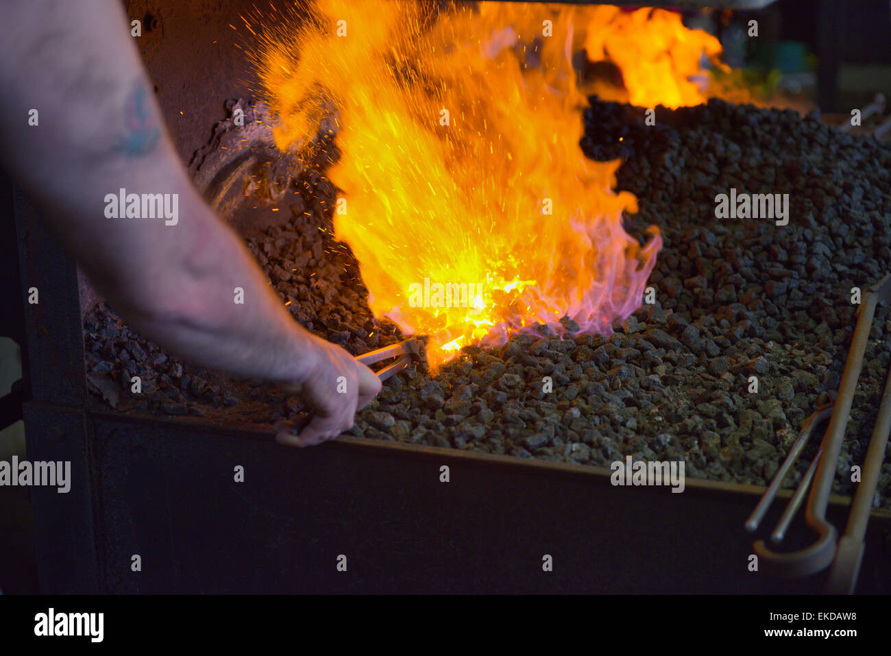 Blacksmith's coke forge with white hot metal Stock Photo - Alamy