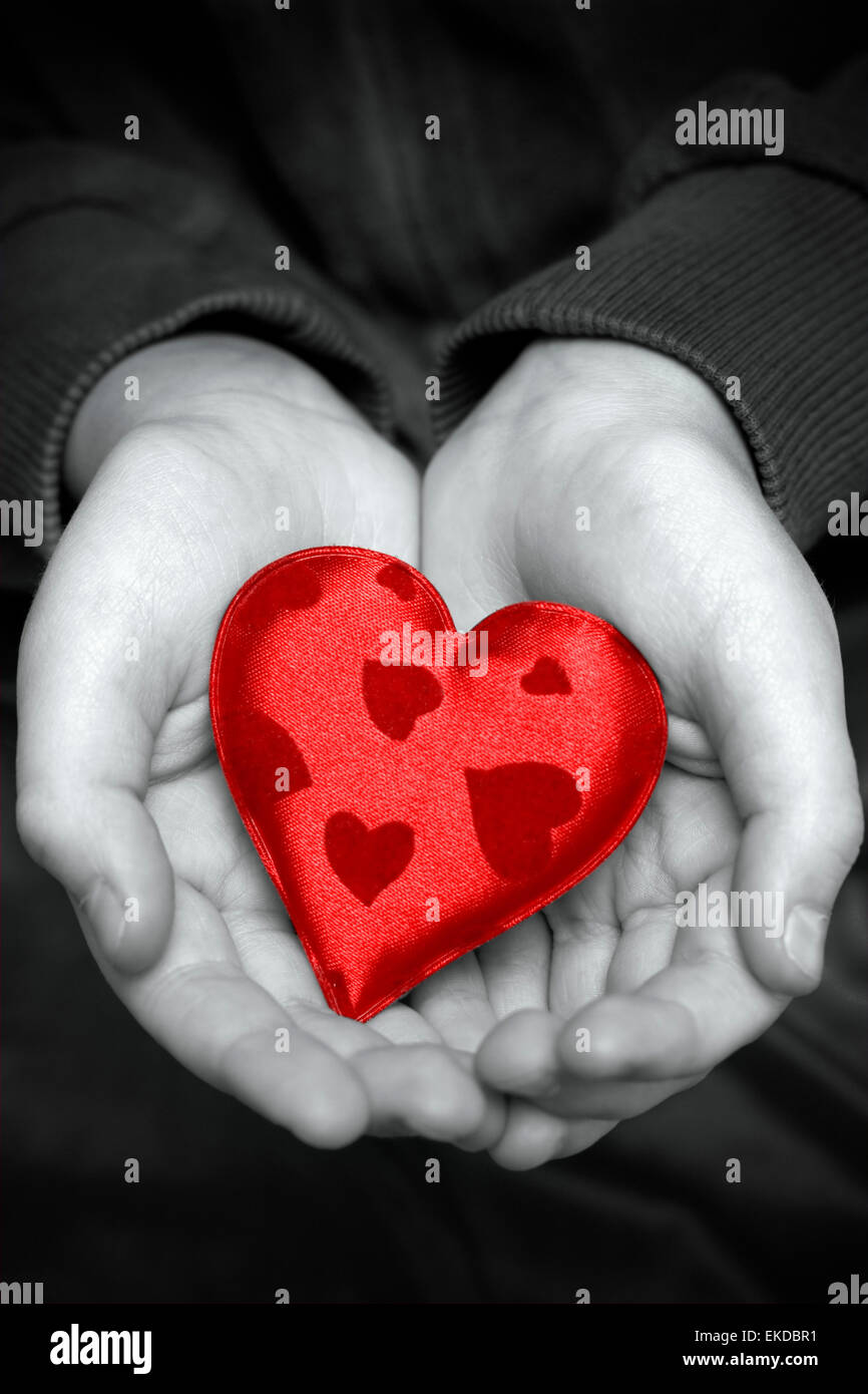 One heart with two hands hi-res stock photography and images - Alamy